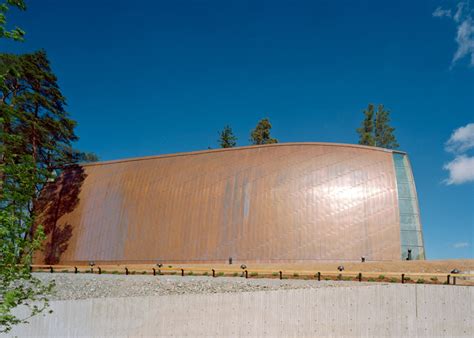 Copper Clad Chapel In Finland Has A Curving Wooden Frame