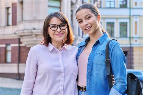 Premium Photo Portrait Of Happy Mom And Teenage Daughter Looking At