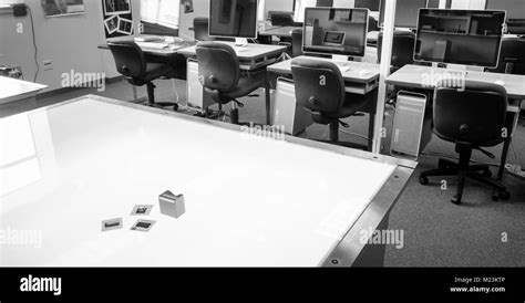 Monochrome Representation Of A College Graphic Design Classroom With Light Table And Slides