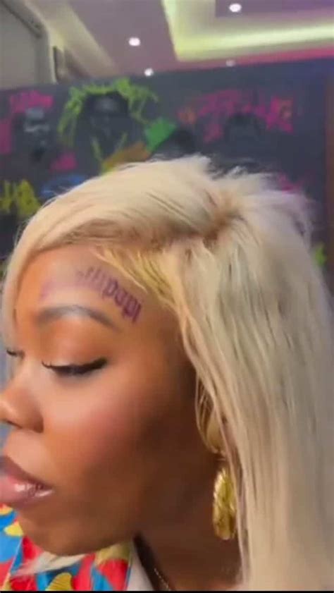 Nigerian Lady Gets A Tattoo Of Shallipopis Name On Her Forehead