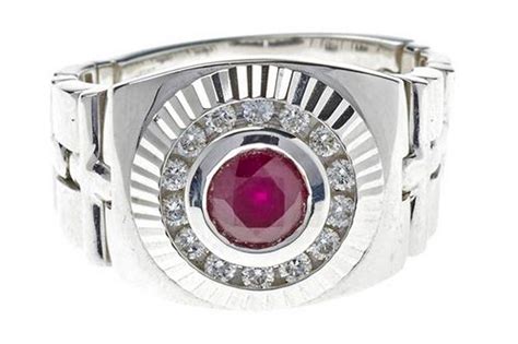 A Gents Ruby And Diamond Ring Centring A Round Cut Ruby Fine