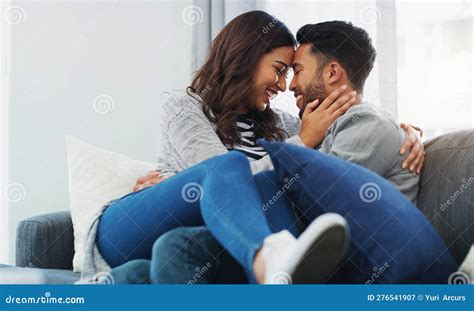 I Will Forever Keep Her Safe An Affectionate Young Couple Cuddling With Each Other While