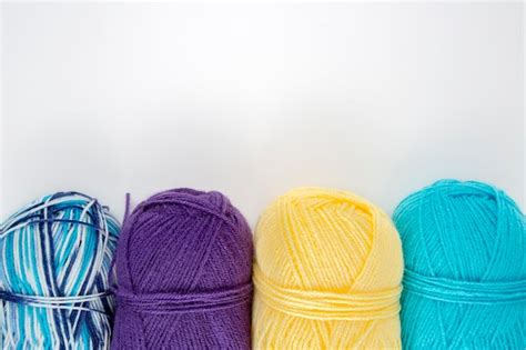 Close Up Shot Of Colored Wool Yarn Balls As Background Premium Photo