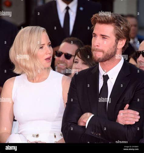 Jennifer Lawrence And Liam Hemsworth Attending The The Hunger Games
