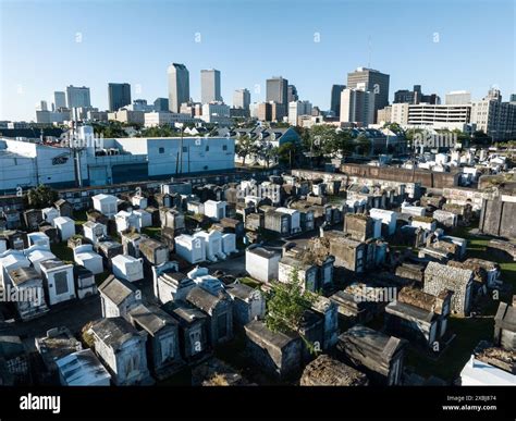Aerial View Of A Historic New Orleans Cemetery With Countless Tombs And
