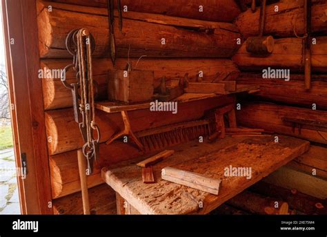 A Rustic Wooden Workshop With Various Tools And Equipment Inside A Log