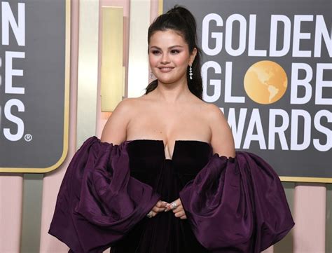 Selena Gomez Goes Blue In Plunging Corset Top and Denim Maxi Skirt