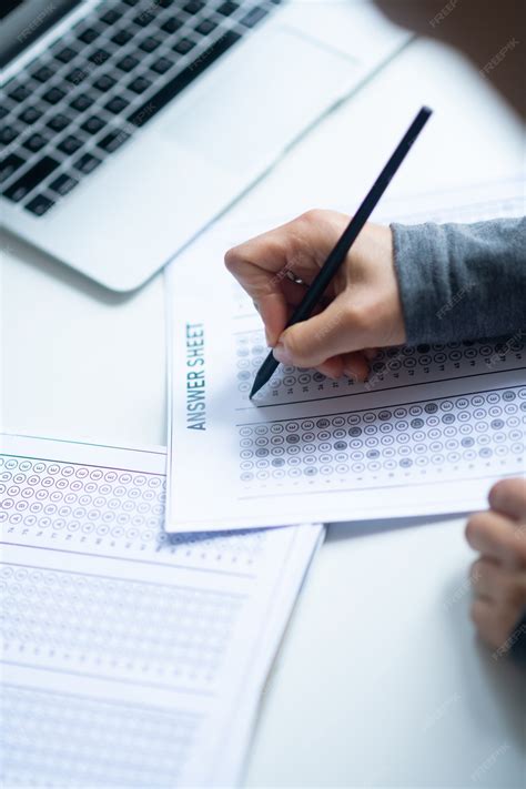 Premium Photo Correcting Tests Top View Of Hard Working Teacher