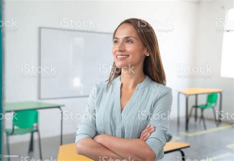 Happy Lady Teacher Looking Hopeful Throw The Window In Classroom Stock