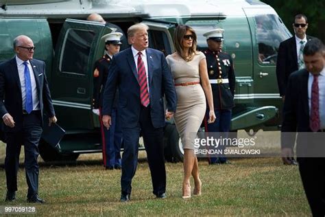 Us President Donald Trump And Us First Lady Melania Trump Walk With