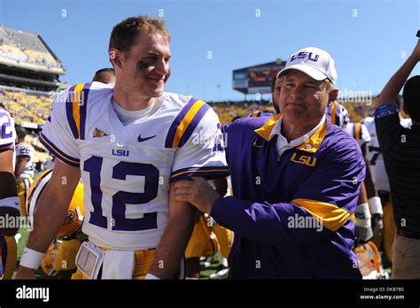 Lsu Tigers Head Coach Les Miles Celebrates With Lsu Tigers Quarterback