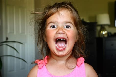 Premium Photo Portrait Of Cute Girl Screaming At Home