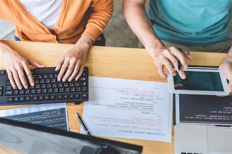 Premium Photo Writing Codes And Typing Data Code Technology Programmer Cooperating Working On