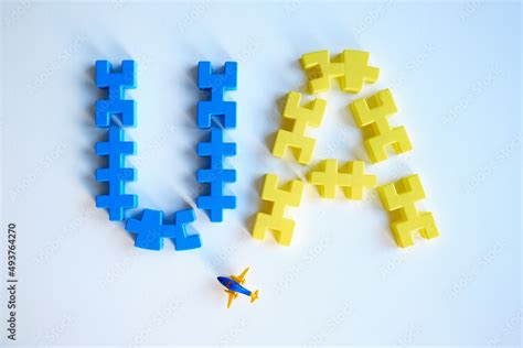 Puzzle Letters Ua Blue Yellow Color And A Small Toy Plane On A Light Background Independence Of
