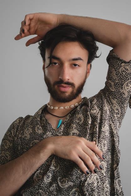 Premium Photo Young Latin Gay Man Looking At Camera Gesturing With