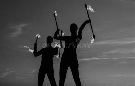 People Silhouette Couple Manipulate Burning Rods Stock Image Image