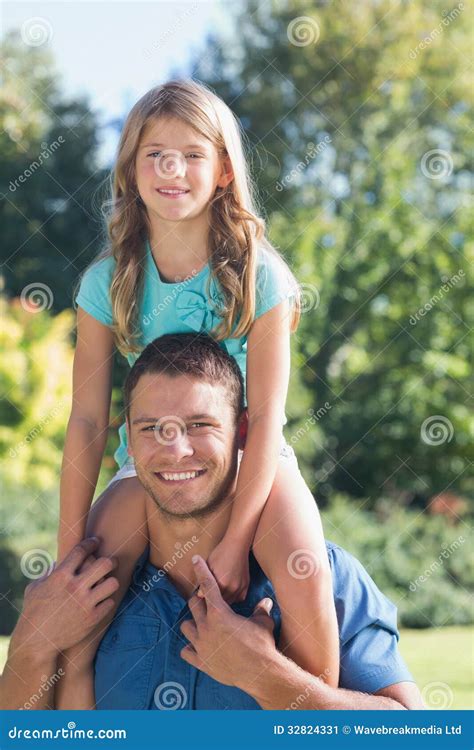 Girl Sitting On Her Dads Shoulder Stock Image Image 32824331