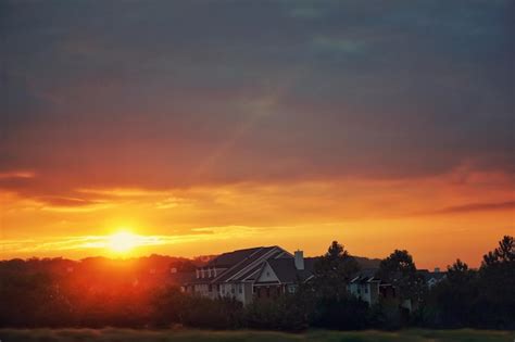 Premium Photo Houses At Sunset