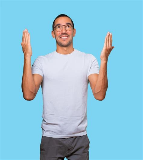 Premium Photo Astonished Young Man Looking Up