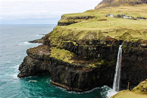 Visit The Fairytale Faroe Islands Waterfall Múlafossur Waterfall In