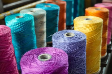 Premium Photo Colorful Thread Spools On A Spinning Machine Textile Threads Industry Generative Ai