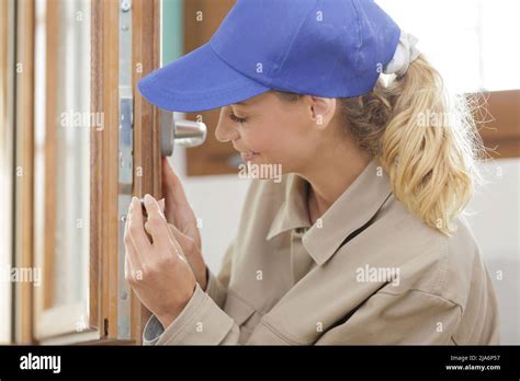 Female Builder Fixing The Window Stock Photo Alamy