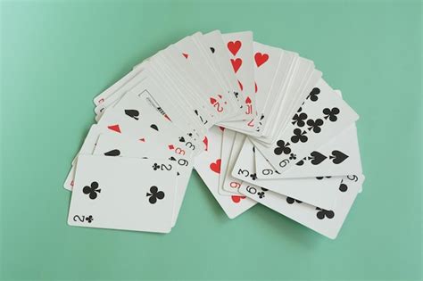 Premium Photo Playing Cards On The Green Background