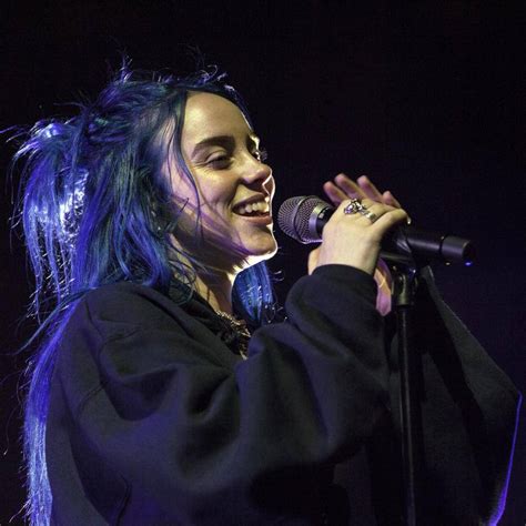 Download Aesthetic Billie Eilish Holding Microphone Blue Hair Wallpaper