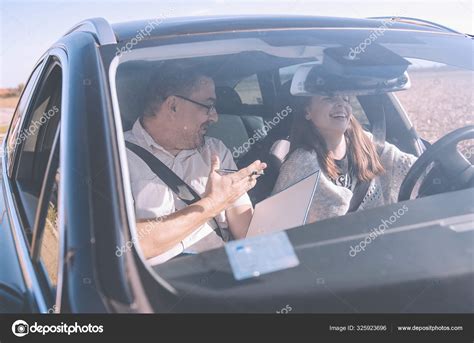 Teenage Girl Test Drivers Licence Sitting Drivers Seat Man Instructor