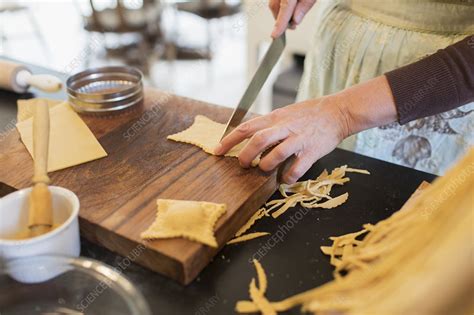 Close Up Woman Cutting Fresh Homemade Pasta Stock Image F0309111