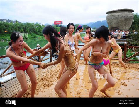 Bikini Dressed Women Have Fun At A Mud Wrestling Event In A Scenic Area