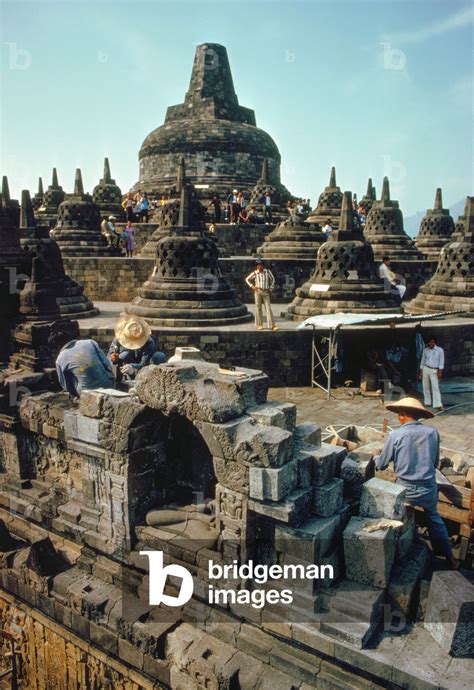 Image Of Artisans Restore The Stone Walls Of The Temple Borobudur