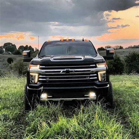 Black Chevrolet Silverado 2500 Hd High Country Truck In Grassy Field