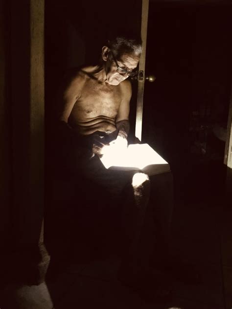 Sr Reading A Book During A Power Outage In South America Rpics