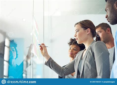 Clarifying Their Latest Business Concepts A Group Of Colleagues Having