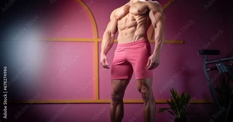 Low Angle View Torso And Legs Of Muscular Male Fitness Model With Well