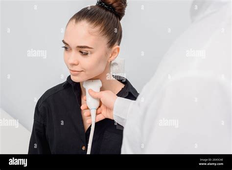 Doctor In Diagnostic Center Making Ultrasound Thyroid Gland Test Stock