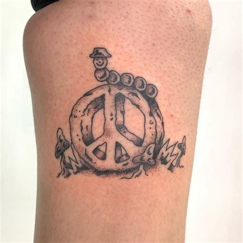 37 Tranquil Ink Exploring The World Of Peace Sign Tattoos Psycho Tats