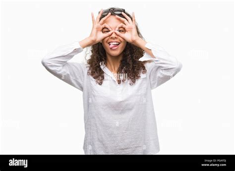 Beautiful Young Hispanic Woman Doing Ok Gesture Like Binoculars