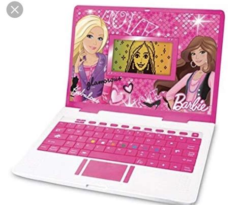 a pink laptop with barbie pictures on the screen