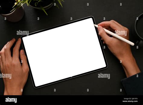 Above View Male Graphic Designer Using Digital Tablet Touchpad With A Stylus Pen On His Modern