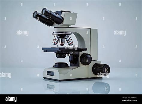 A High Quality Laboratory Microscope Sits Elegantly On A Smooth Surface