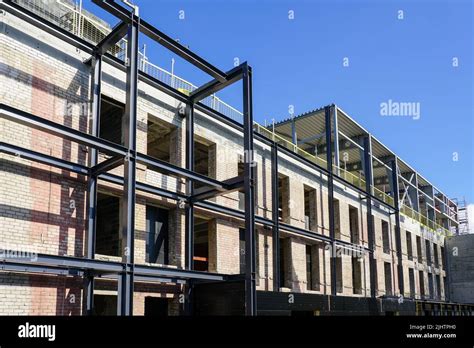 Reconstruction And Modernization Of An Old Brick Building By Expanding