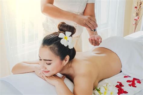 Premium Photo Midsection Of Woman Massaging Customer Lying On Bed