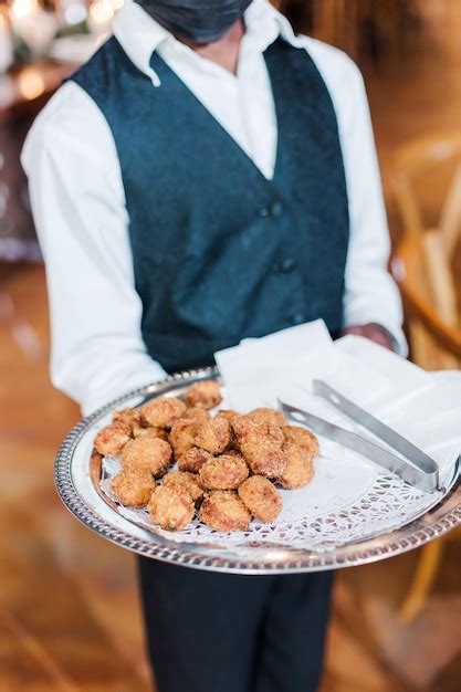 Premium Photo Vertical Shot Of A Server Wearing A Dark Teal Vest