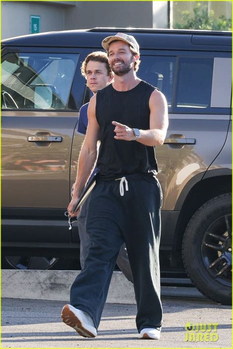 Patrick Schwarzenegger Shows Off His Arms While Stepping Out With John
