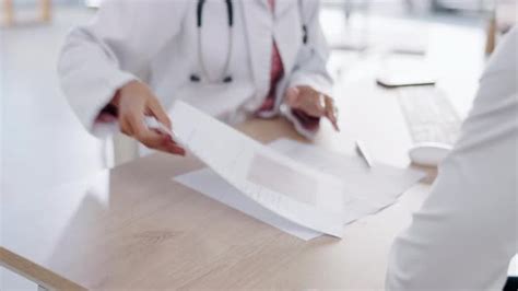 Doctor Hands And Paperwork For Healthcare Test Exam Or Application At