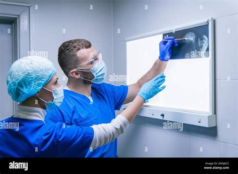 Two Doctors Are Examining An X Ray Radiology Medical Concept Mixed