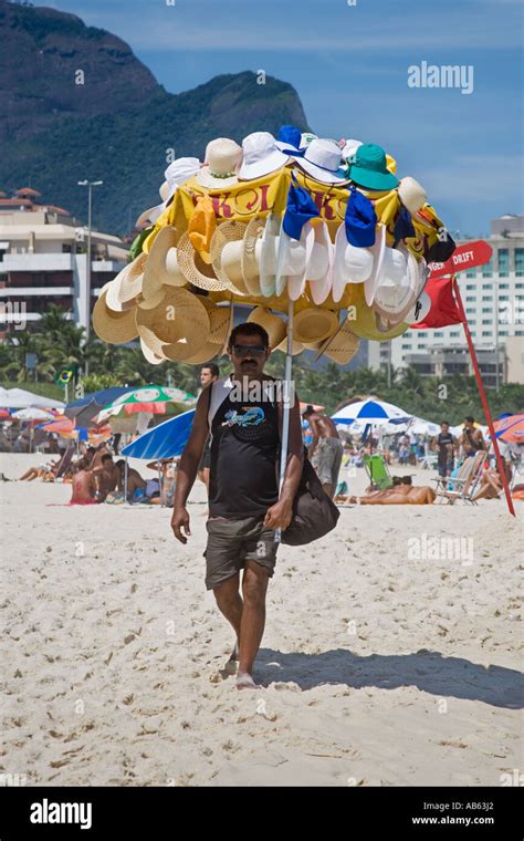 Man Selling Hats On Copacabana Beach In Rio De Janeiro In Brazil Stock