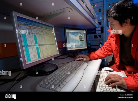 Mud Logging Geologist In Mud Log Control Room Viewing Results From Onshore Oil And Gas